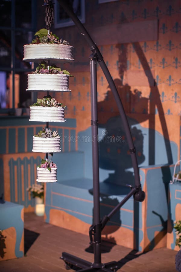 Multilevel Wedding Hanging Cake Decorated with Flowers Stock Image ...