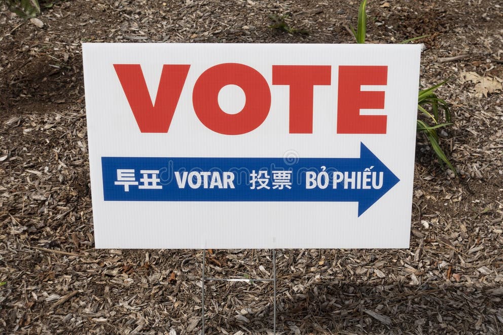 A Multilingual Voting Sign with Arrow in Red White and Blue Stock Photo ...