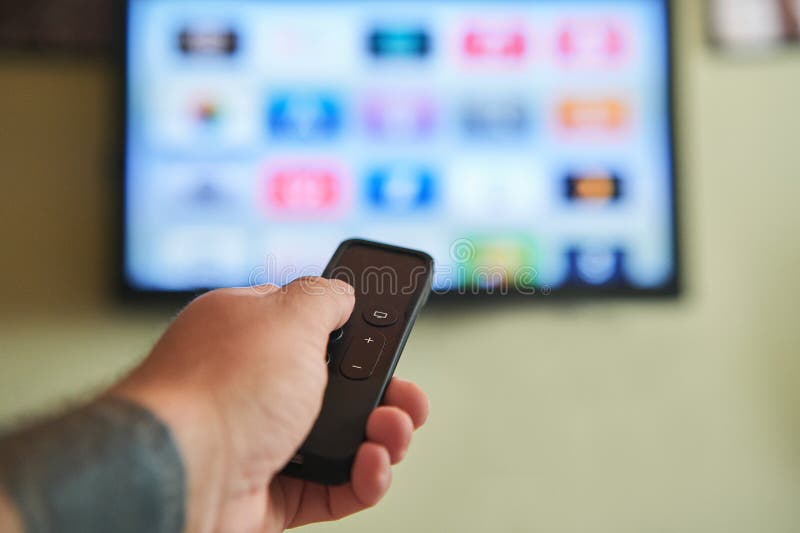 Hand Holding Remote Control. TV Screen with Lot of Pictures Stock Image ...