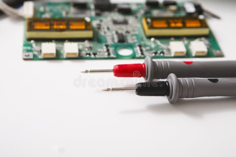 Multimeter and Broken Mobile Electronics at Repair Shop Stock Photo ...