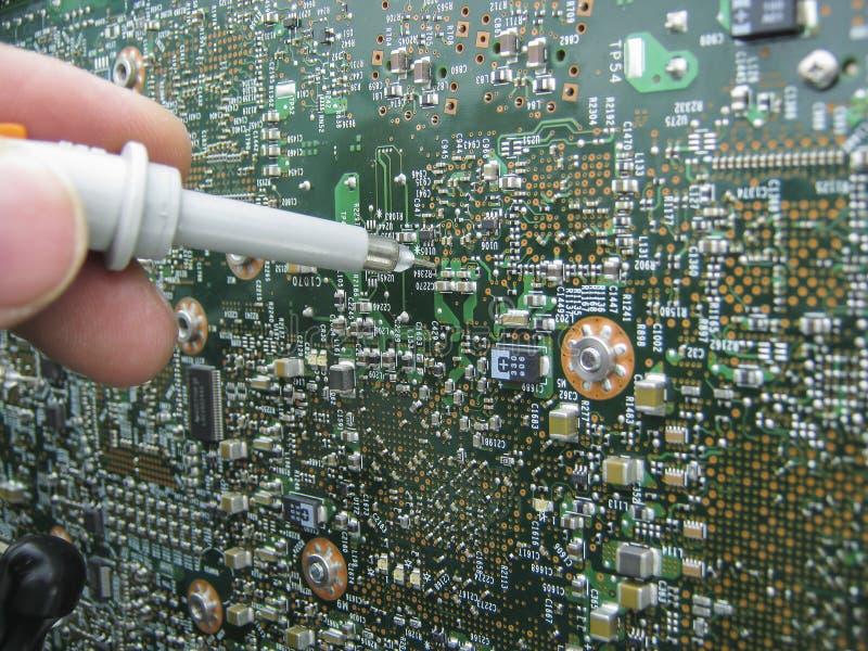 Multimeter Probes Examining a Circuit Board Stock Photo - Image of ...