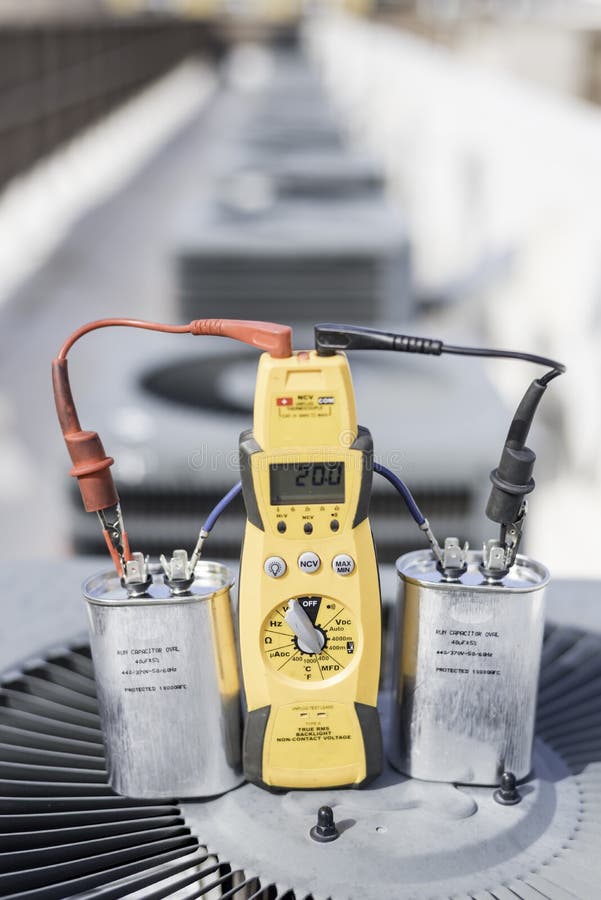 Multimeter and Run Capacitors on Condenser Vertical Background Stock ...