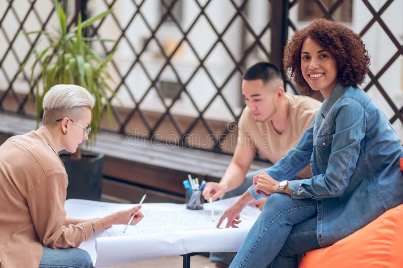 Multinational Architectural Team Working on a Site Development Plan Stock Image - Image of ...