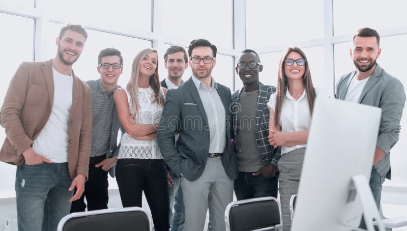 Multinational Business Team Standing in a Bright Office Stock Photo ...