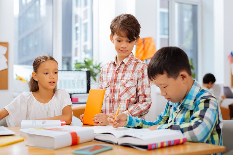 Multinational Classmates Studying Together in a Classroom Stock Image ...