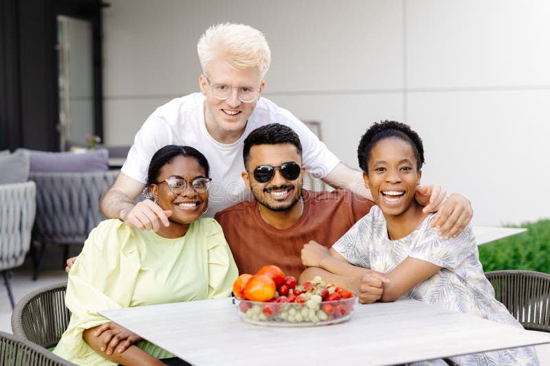 Multinational Friends Having Fun in Outdoor Cafe in Summer Time Stock ...
