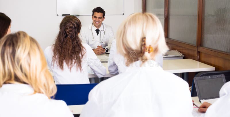 Professor Having Discussion with College Students Stock Photo - Image ...