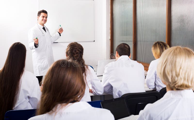 Multinational Interns and Professor Having Discussion Stock Image ...