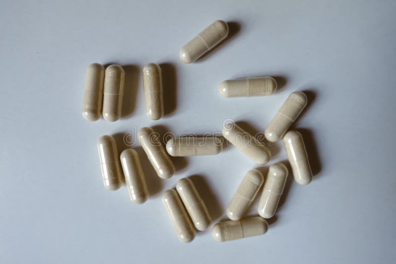 Multiple Beige Capsules of Saccharomyces Boulardii Probiotic from Above ...