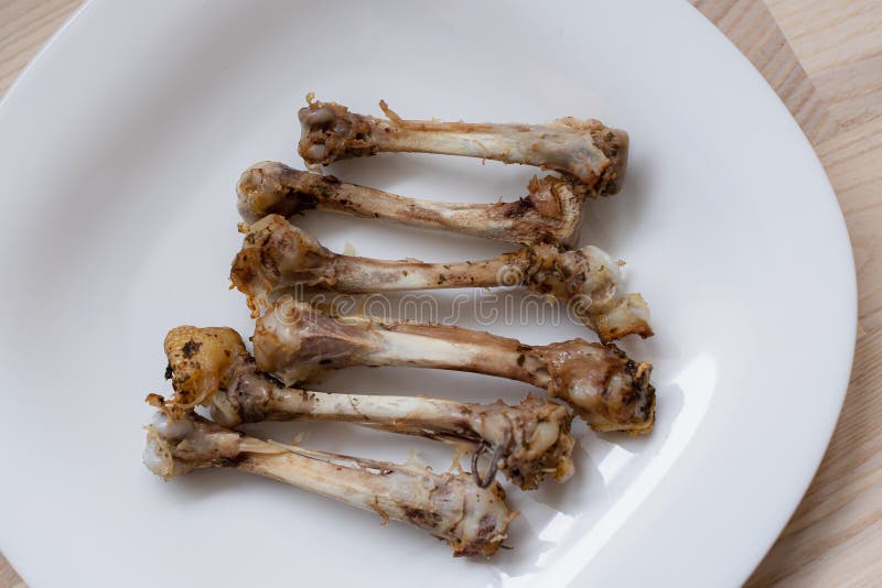 Multiple Chicken Bones on a White Plate Stock Image - Image of prepare ...