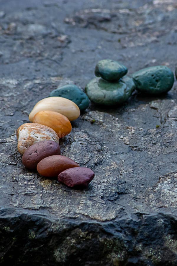 Multiple Colored Stones on Slab of Rock Stock Photo - Image of hard ...