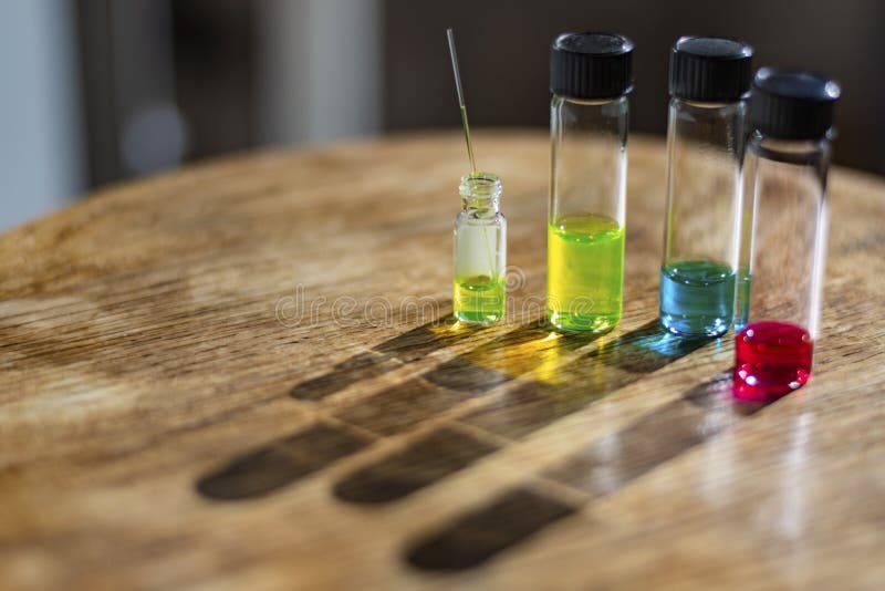 Colourful Solutions in Different Vials with Capillary Under the Light ...