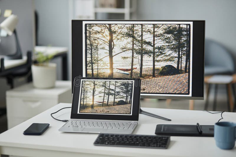 Multiple Computer Devices with Travel Photos on Screen Stock Photo ...