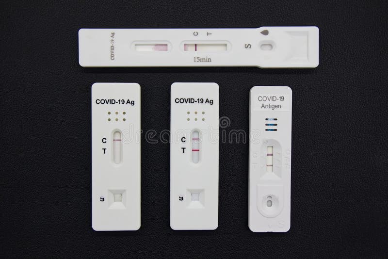 Multiple Covid-19 Antigen Test Kits Isolated on Black Background ...