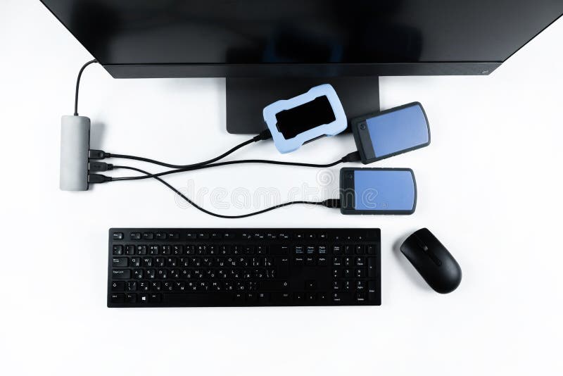 Multiple External Hard Drives Connected To a Monoblock on a White ...