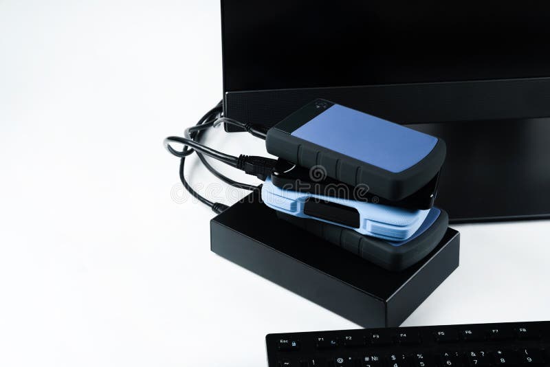 Multiple External Hard Drives Connected To a Monoblock on a White ...
