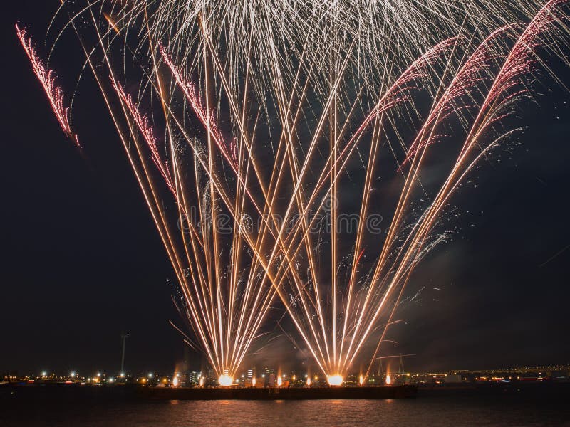 Multiple Fireworks Burst in the Night Sky with Light Trails Stock Photo ...