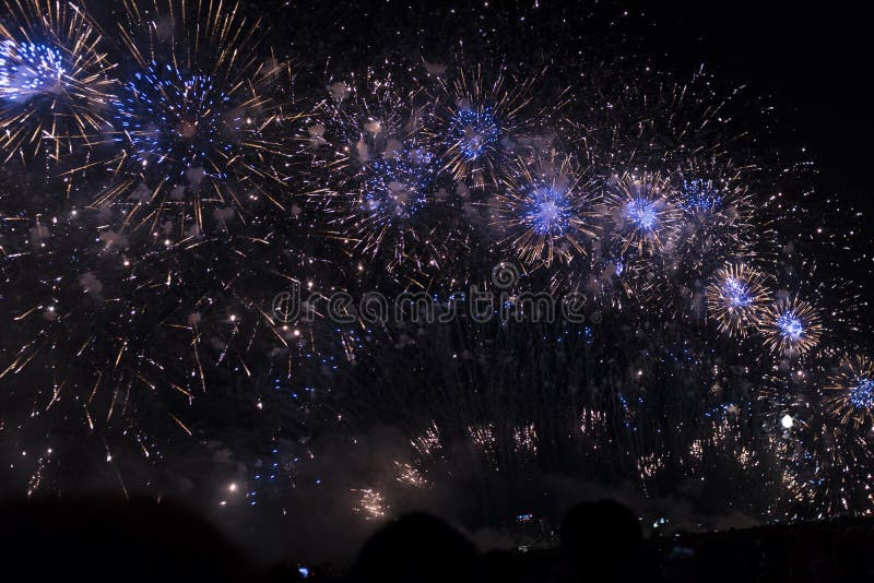 Multiple Fireworks in Night Sky in a Composition in Shades Gold and ...