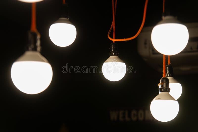Many Light Bulbs are Suspended from the Ceiling in a Room Stock Image ...