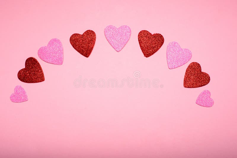 Multiple Hearts with Glitter Forming an Arc on Pink Background. Stock ...