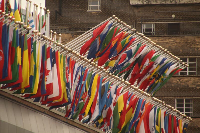 International Flags in Front of a Brick Building Stock Image - Image of ...