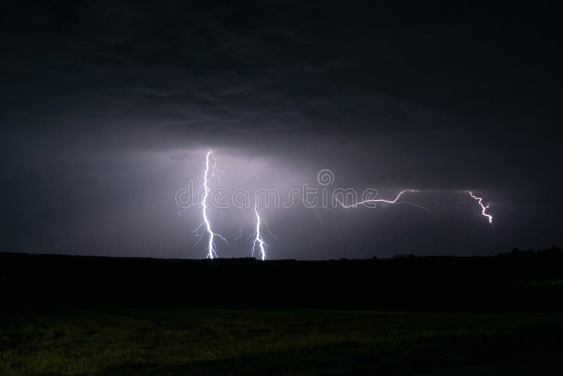 Multiple Lightning Strikes Lighting Up the Sky on a Summer Evening ...