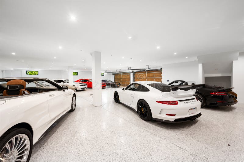 Luxurious Vehicles Parked Inside a White-wall Room Editorial Stock ...