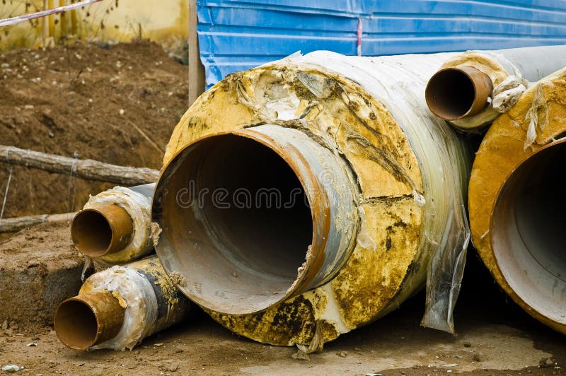 Multiple Metal Pipes with Yellow Heat Isolation. Stock Photo - Image of ...