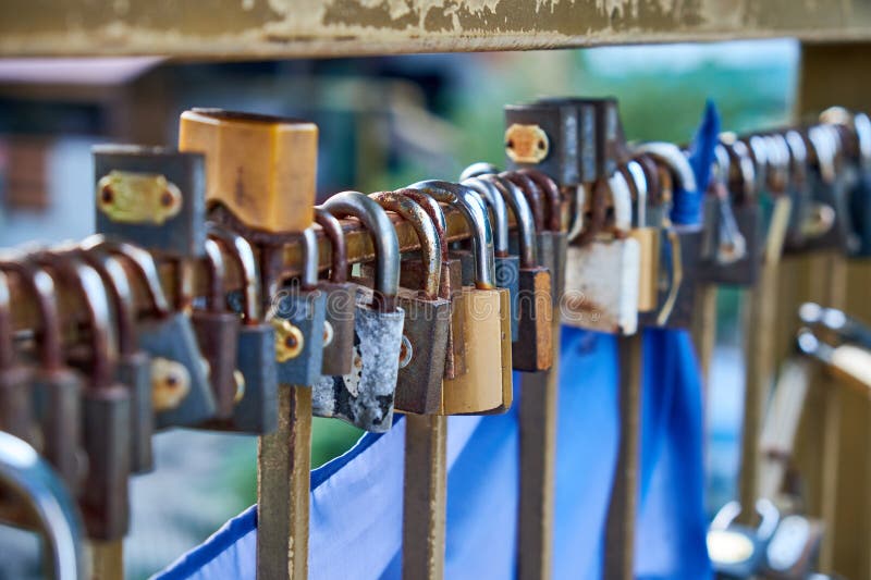 A Multiple Padlocks Attached To a Metal Railing Stock Photo - Image of ...