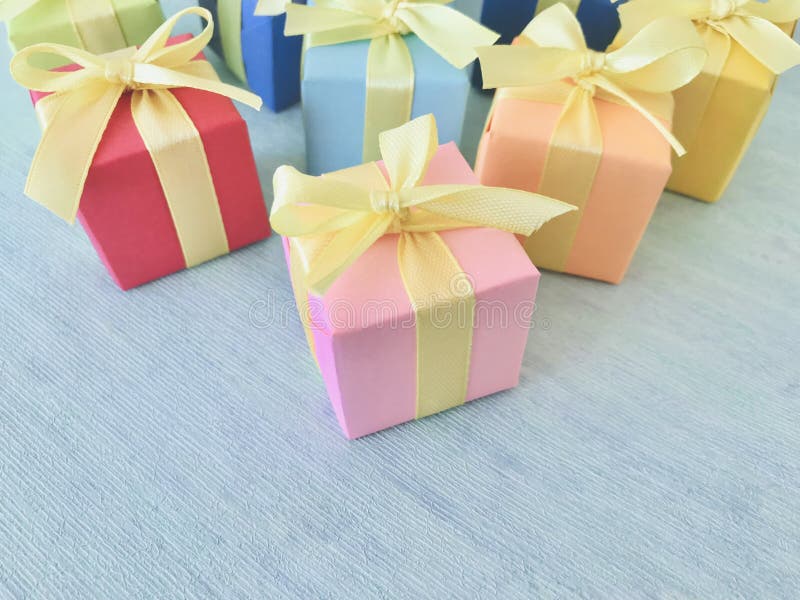 Multiple Rainbow Color Square Gift Boxes on Blue-green Watercolor ...