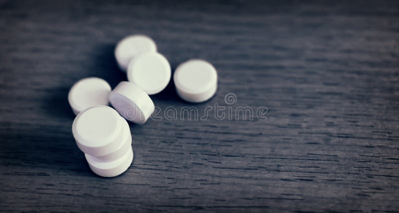 Multiple Round White Tablets Randomly Left on a Table. Stock Photo ...