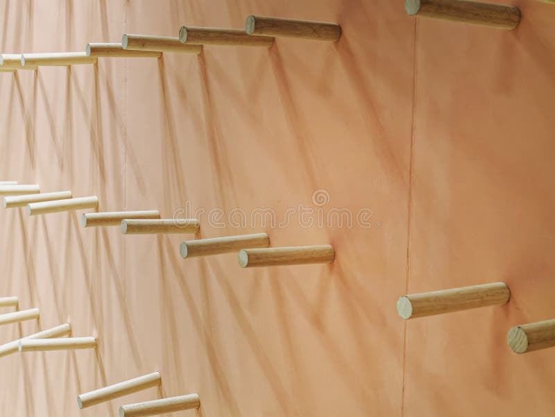 Multiple Rows of Decorative Cylindrical Wood Sticks on the Wall Stock ...
