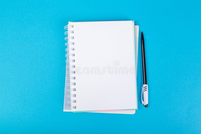 Stack of School Exercise Books on Blue Background, Spiral Notepad with ...