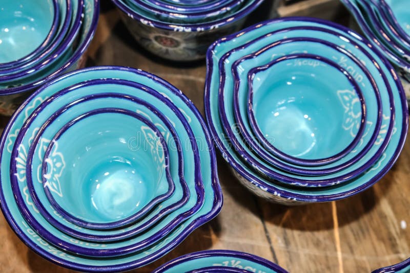 Multiple Sets of Blue Ceramic Mixing Cups with Attractive Design Viewed ...