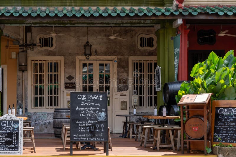 Several Signs and Chalk Boards on the Side of a Building Stock Photo ...
