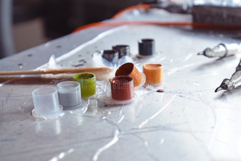 Multiple Small Transparent Ink Pots Filled with Tattoo Ink Lying on ...
