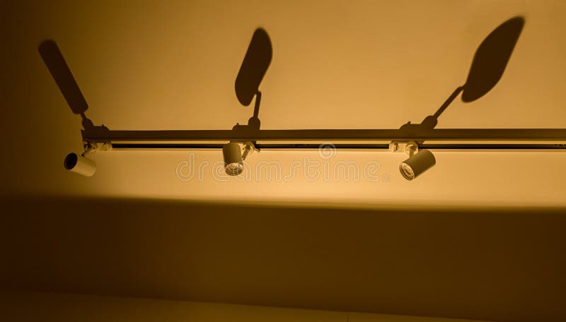 Multiple Spotlights Railing on Ceiling Wall. Stock Image - Image of ...