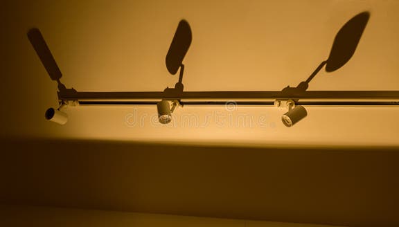 Multiple Spotlights Railing on Ceiling Wall. Stock Image - Image of ...
