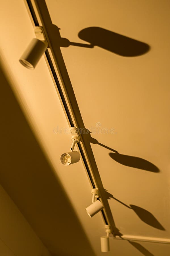 Multiple Spotlights Railing on Ceiling Wall. Stock Image - Image of ...