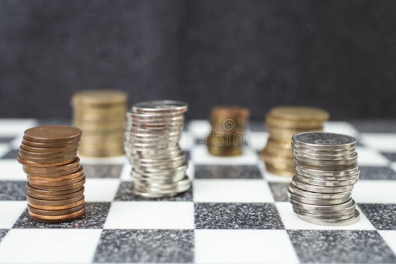 Multiple Stacks of Coins on a Chess Board Stock Photo - Image of game ...