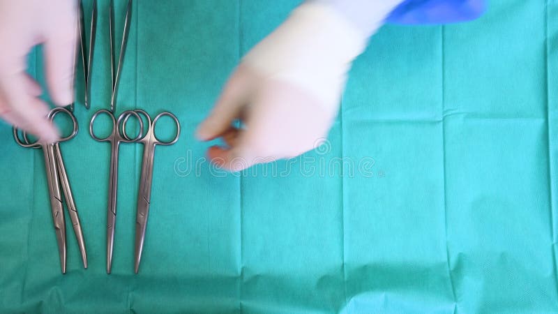 Multiple Surgery Instruments on Blue Table Above View. Surgeon Take ...
