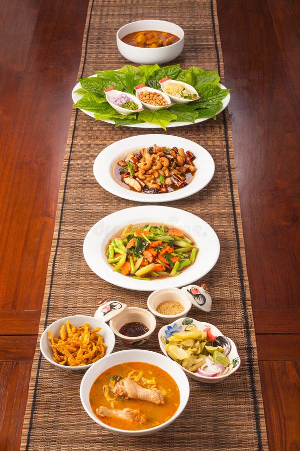 Multiple Thai Food Dishes on Dark Wooden Table Stock Photo - Image of ...