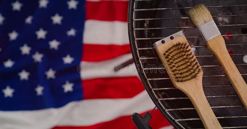 Multiple Tools Over Barbeque Grill Against American Flag Background ...