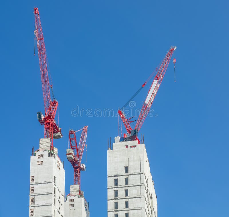 Multiple Tower Cranes Above a Concrete Structure Stock Image - Image of ...