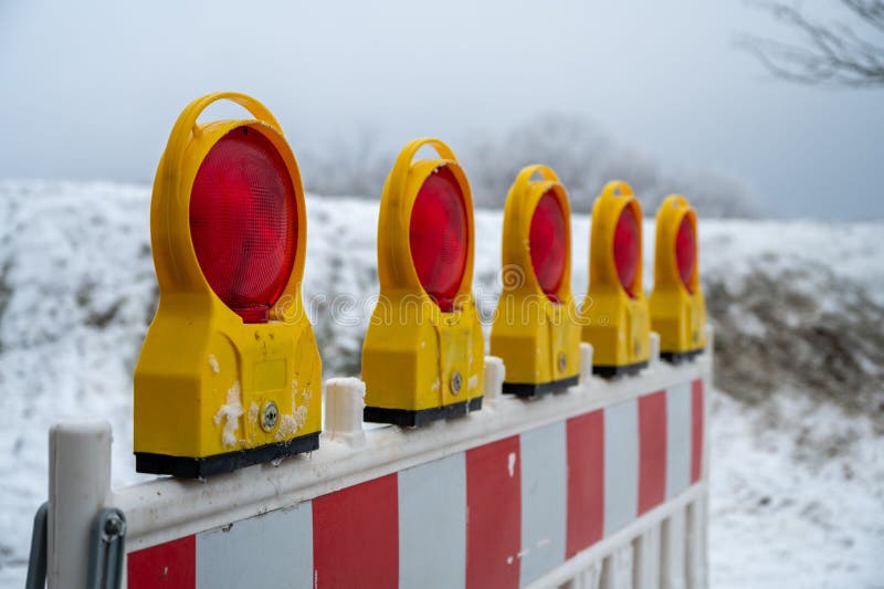 Multiple Traffic Lights Placed Atop a White Fence in the Snow Stock ...