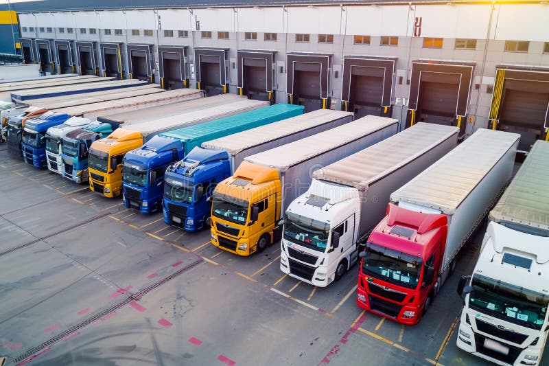 Multiple Trucks Lined Up at a Loading Dock, Ready for Cargo Loading and ...
