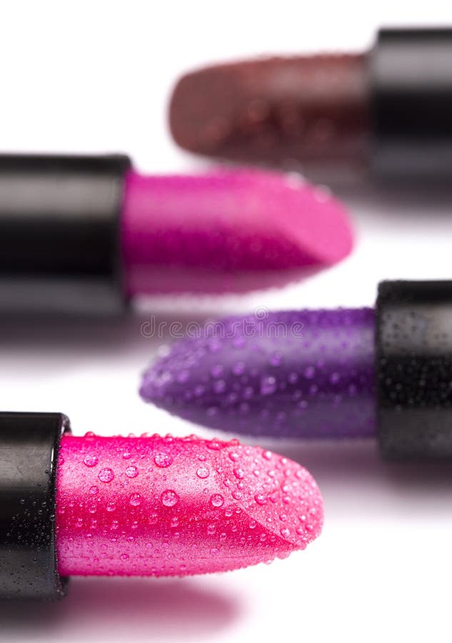 Multiple Tubes of Different Colored Lipsticks on a White Background ...