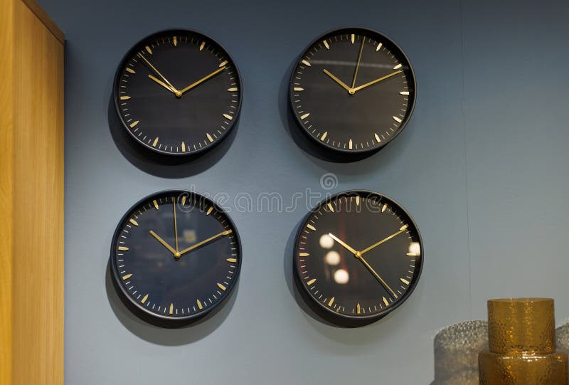 Multiple Wall Clocks on the Wall Stock Image - Image of hanging, dial ...