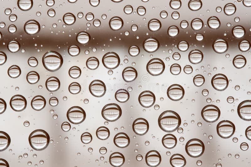 Multiple Water Drops or Raindrops of Different Sizes on a Window Glass ...