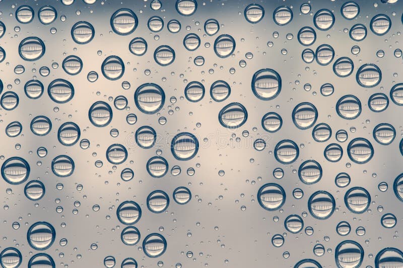Multiple Water Drops or Raindrops of Different Sizes on a Window Glass ...